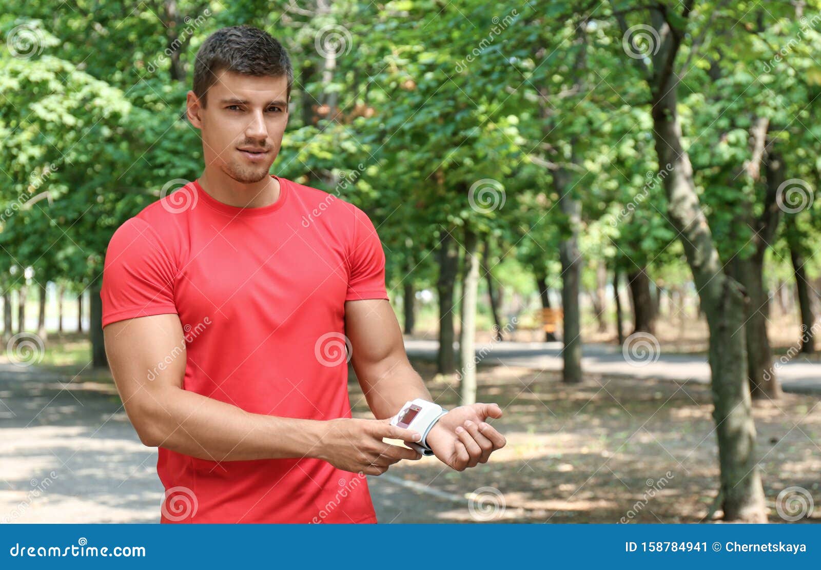 Young Man Checking Pulse with Medical Device after Training Stock Image ...