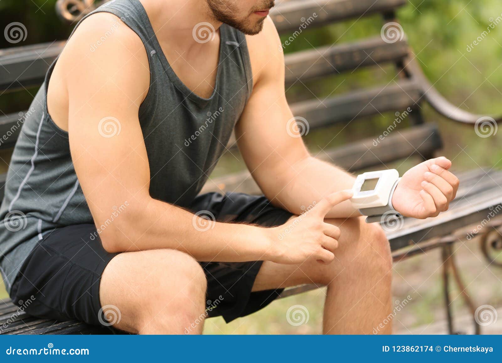 Young Man Checking Pulse Outdoors Stock Photo - Image of checking ...