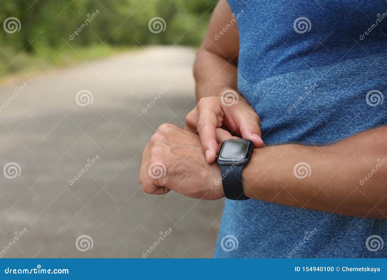 Young Man Checking Pulse with Smartwatch Training in Park, Closeup ...