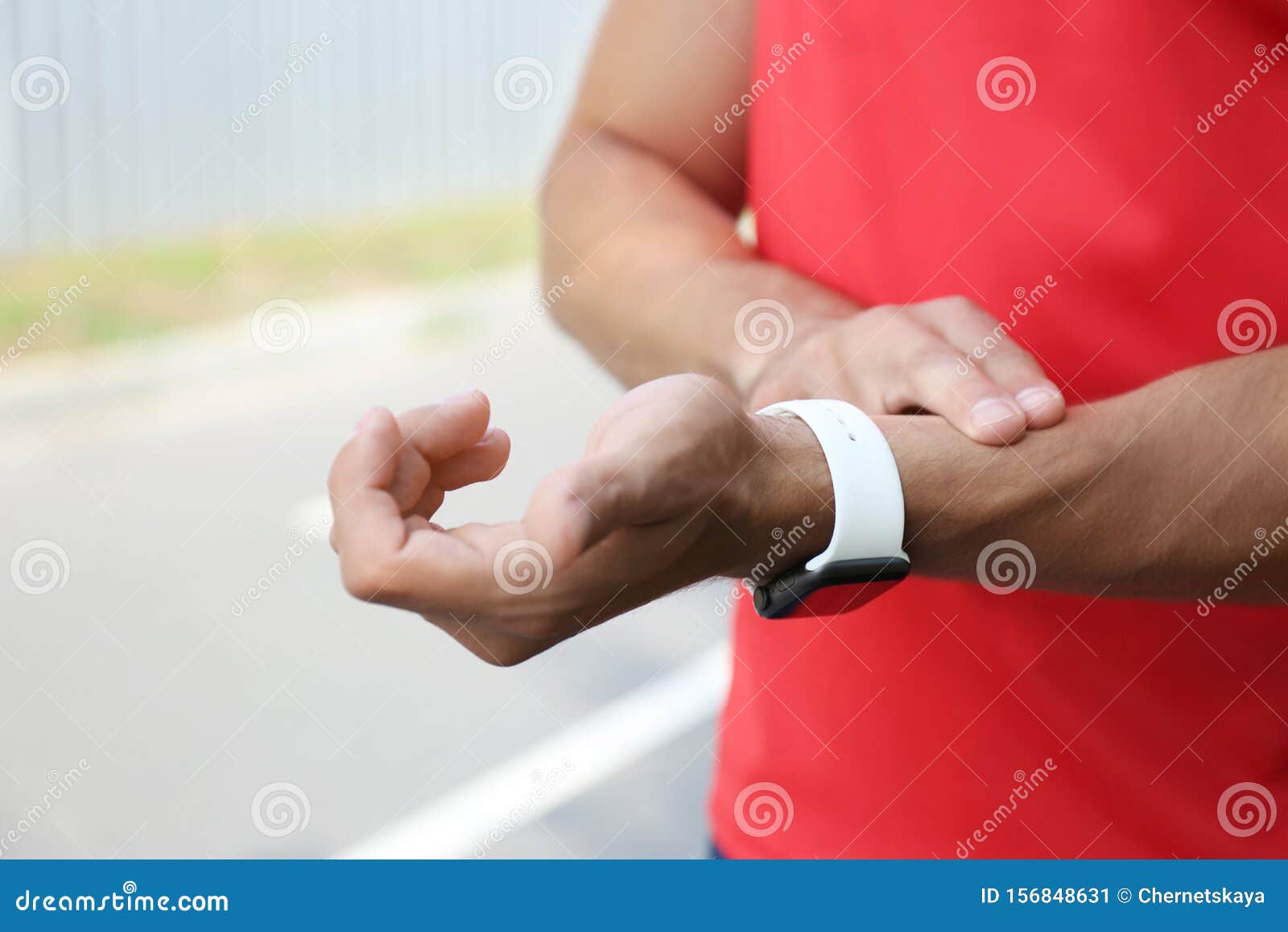Young Man Checking Pulse after Outdoors, Closeup Stock Image - Image of ...