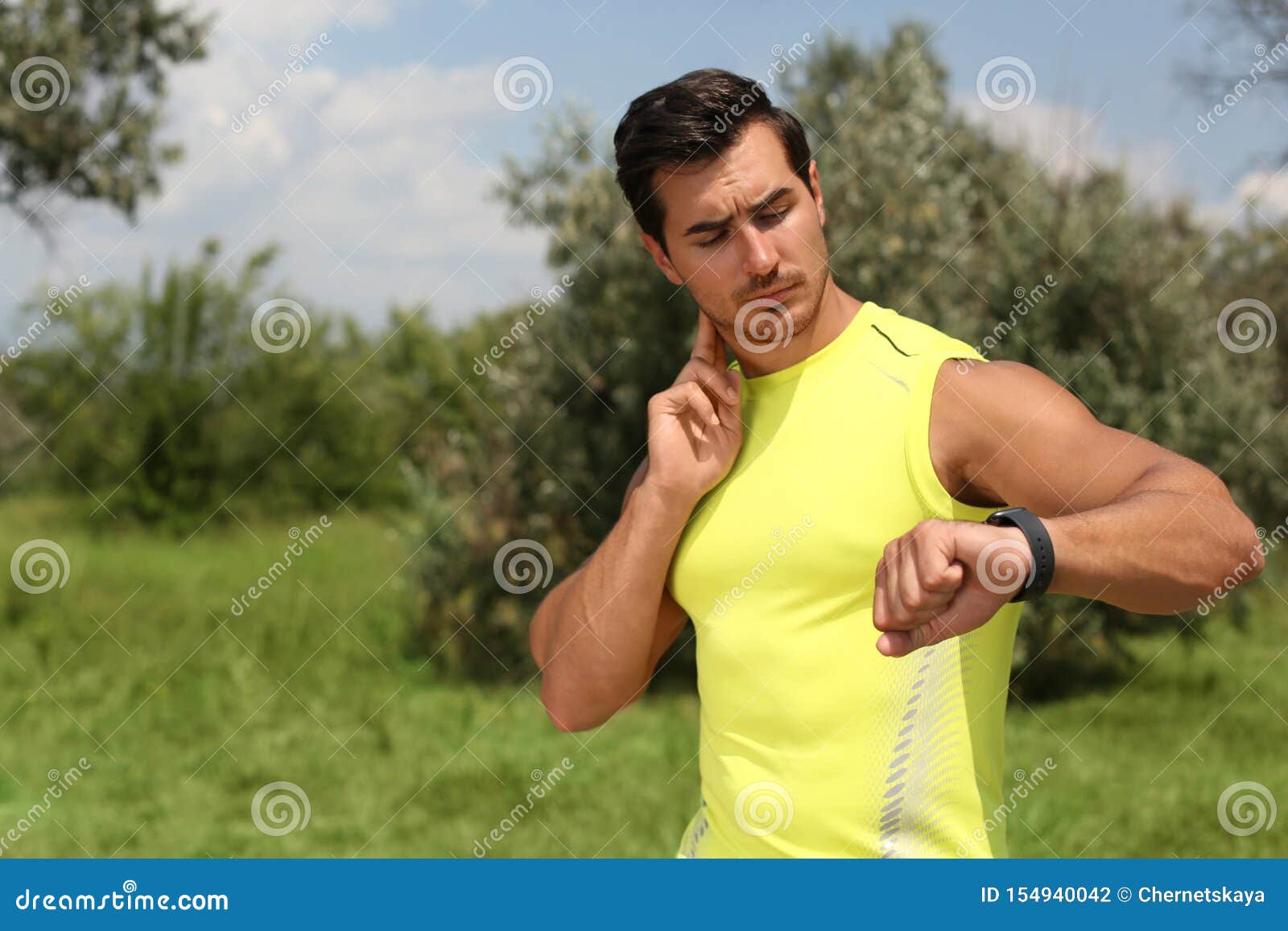 Young Man Checking Pulse after Training in Park. for Text Stock Photo ...