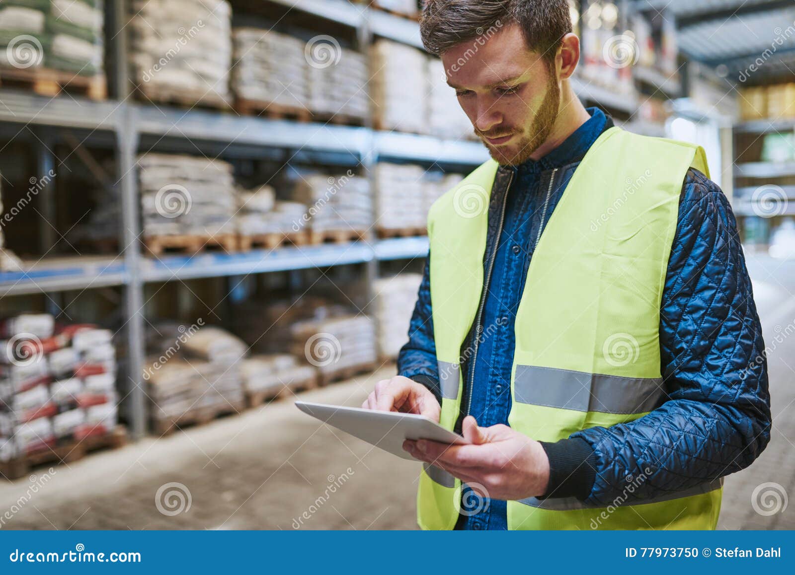 Young Man Checking Supplies on His Tablet Stock Photo - Image of ...
