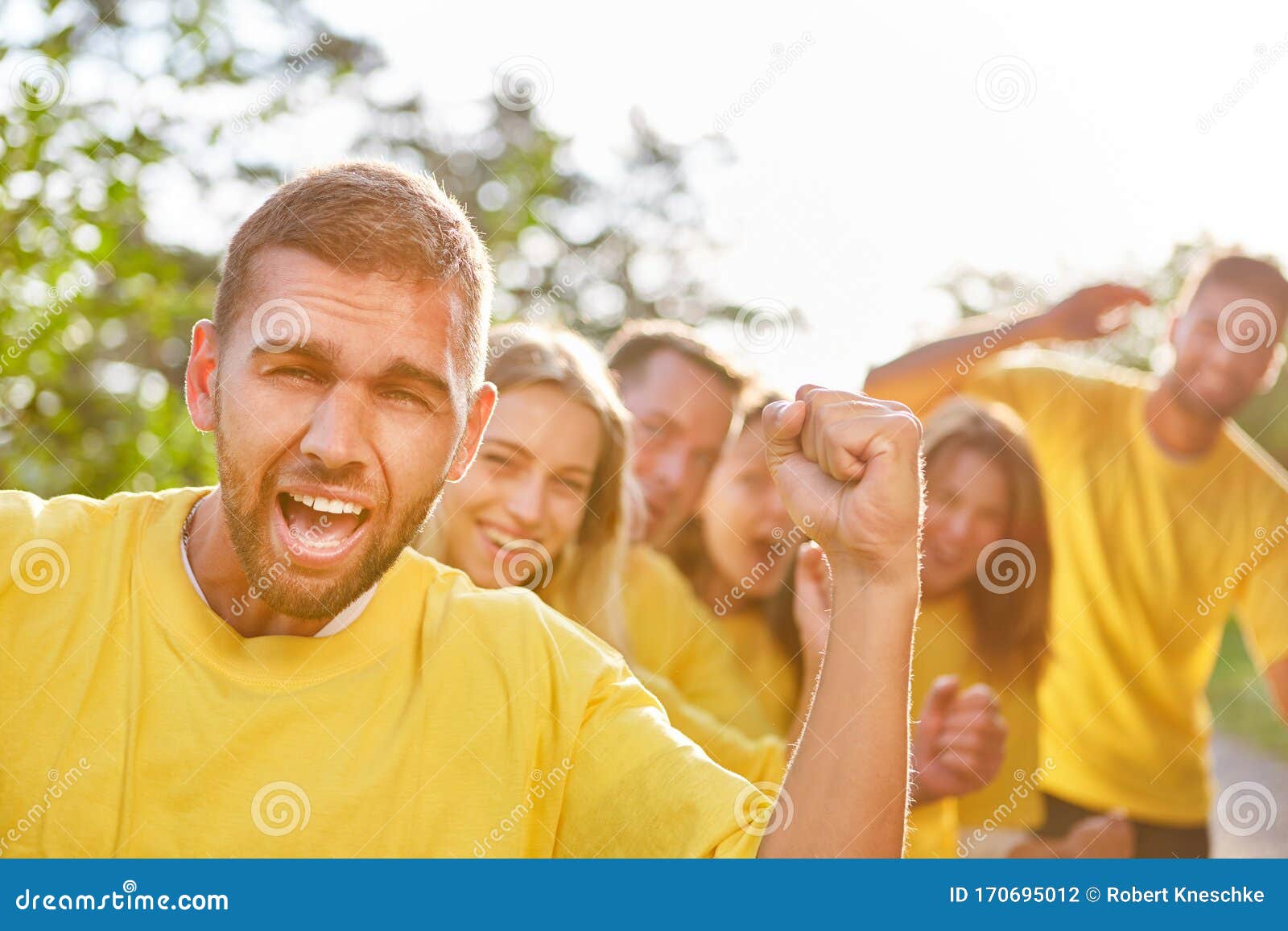Young Man Cheers with His Team Stock Photo - Image of friendship ...
