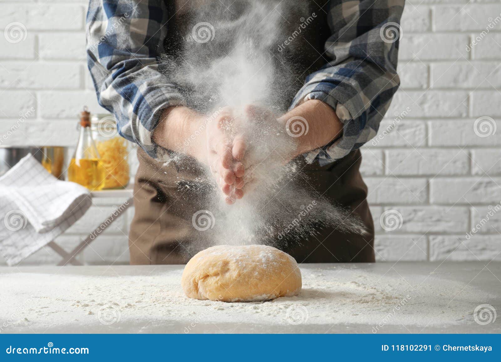 Young Man Sprinkling Flour on Dough for Pasta at Table Stock Image ...
