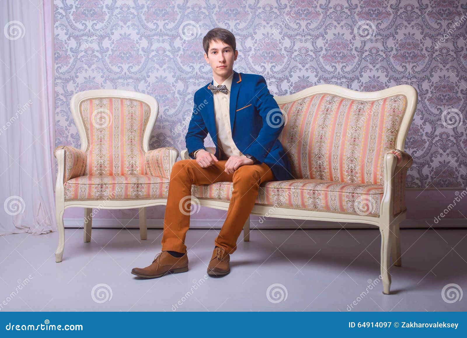 Young Man in Classic Suit is Sitting on the Couch Stock Image - Image ...