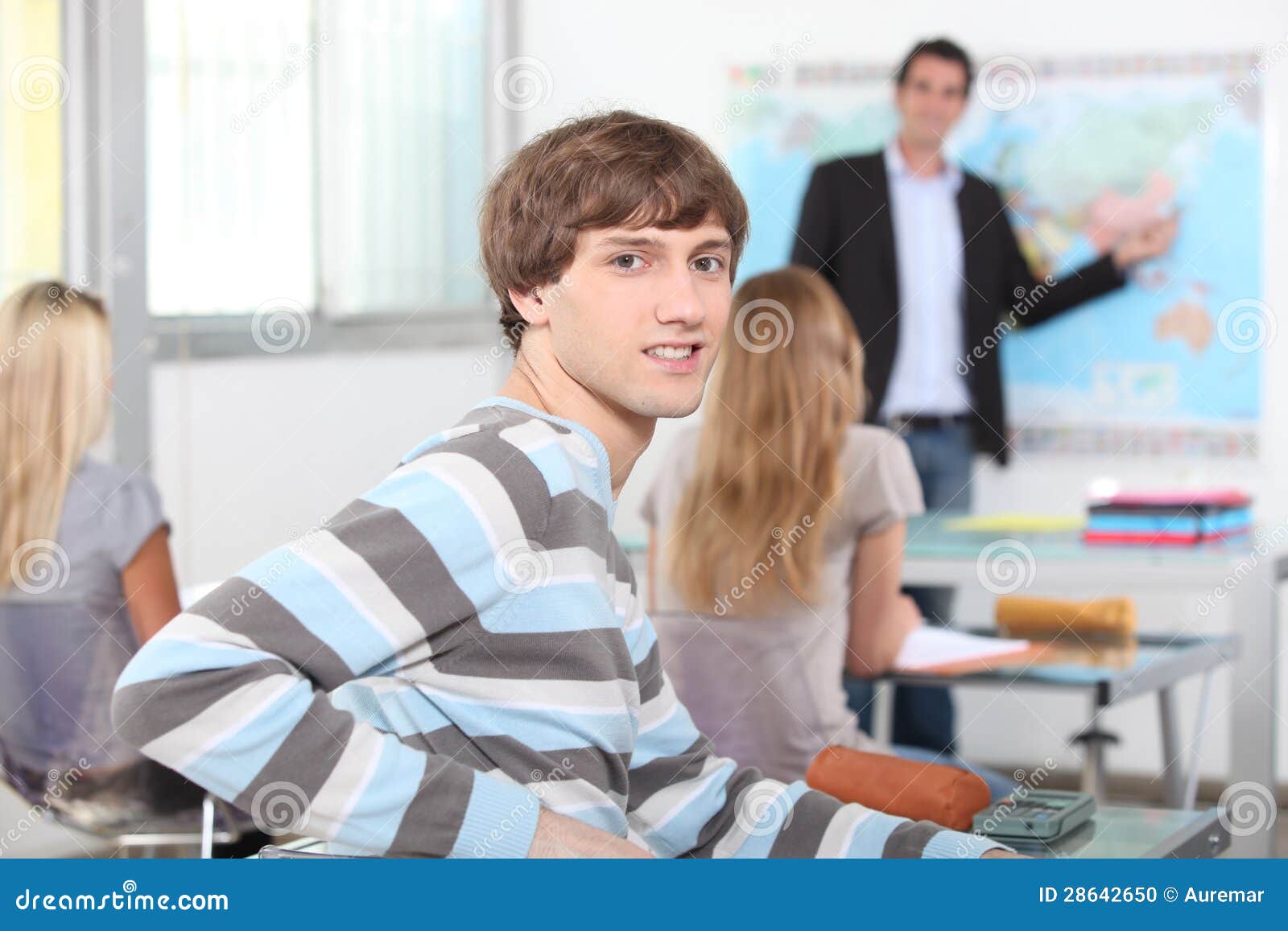 Young man in a classroom stock photo. Image of geography - 28642650