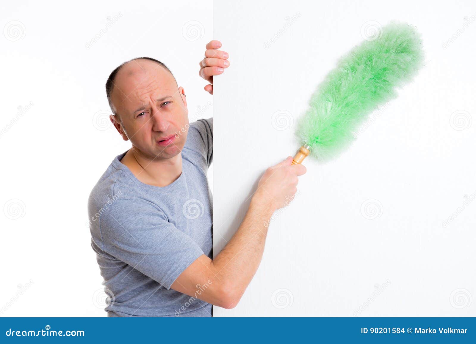 Young Man Cleaning with Feather Duster Stock Photo - Image of feather ...