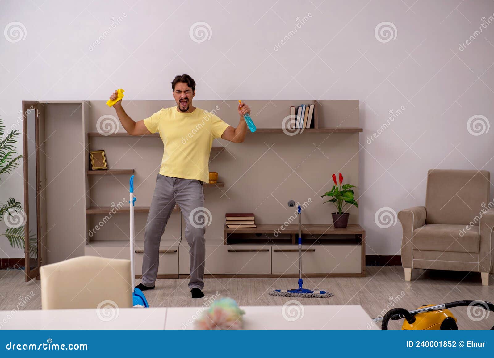 Young Man Doing Housework at Home Stock Photo - Image of contractor ...