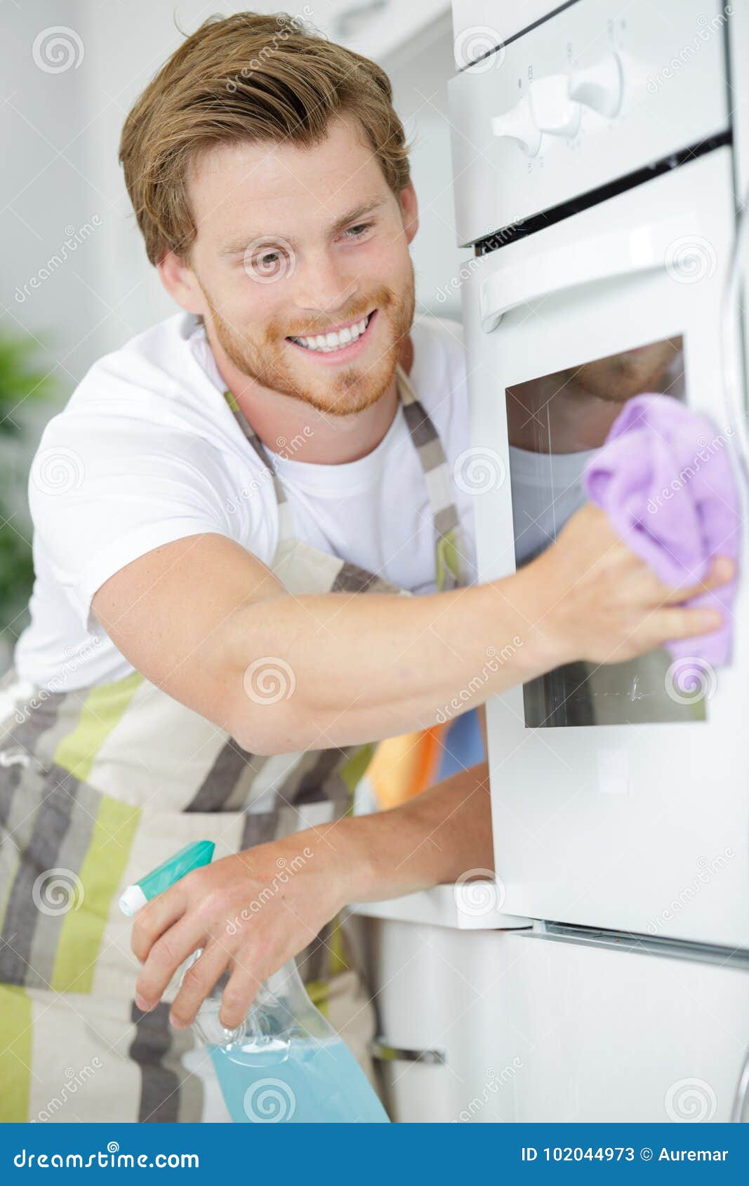 Young Man Cleaning Oven in Kitchen Stock Image - Image of service ...