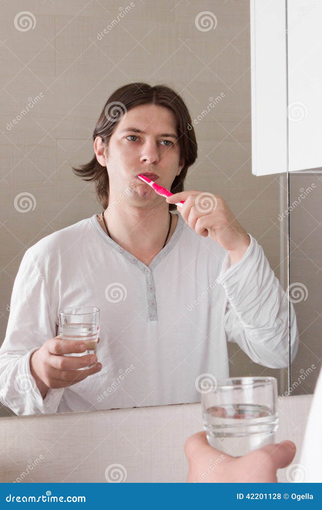 Young man cleaning teeth stock photo. Image of clean - 42201128