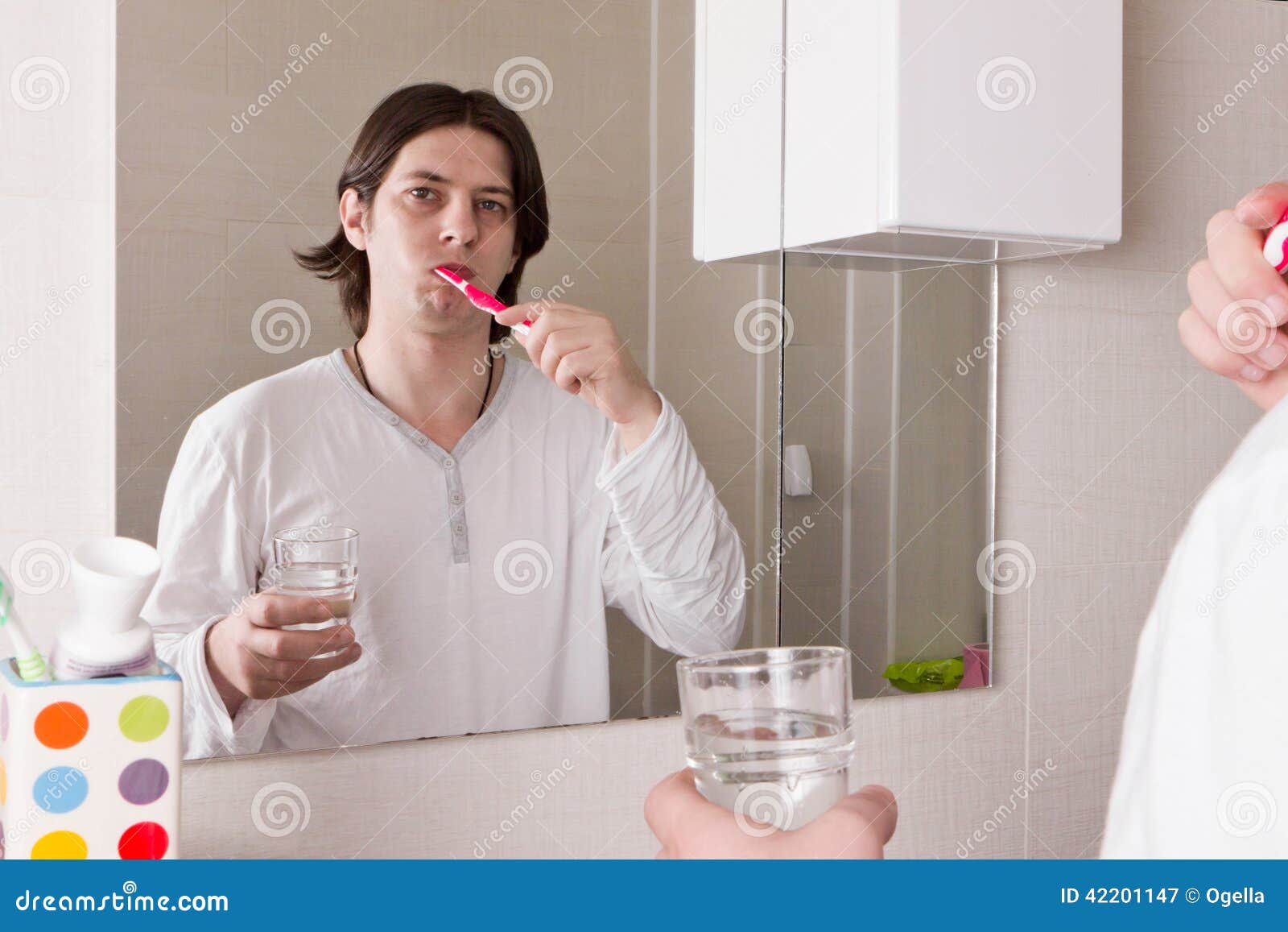 Young man cleaning teeth stock image. Image of washing - 42201147