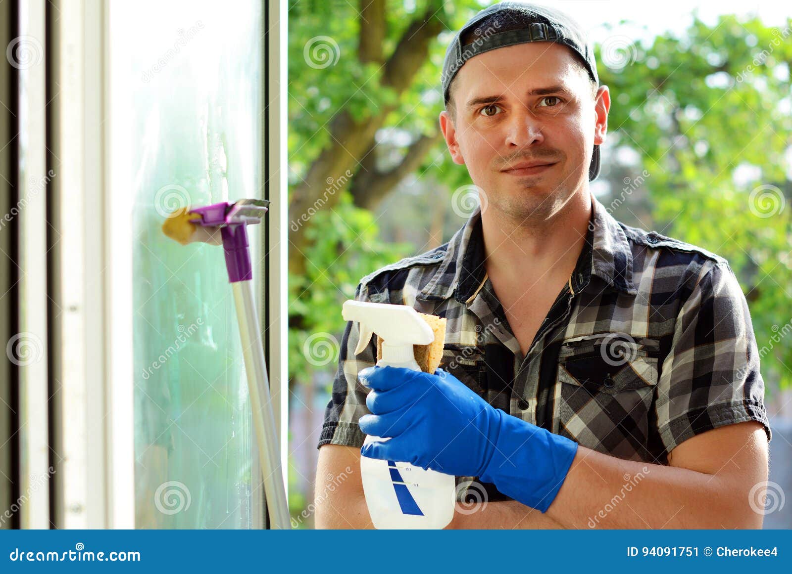 Young Man Cleaning Windows. Professional Cleaning Company. Stock Image ...