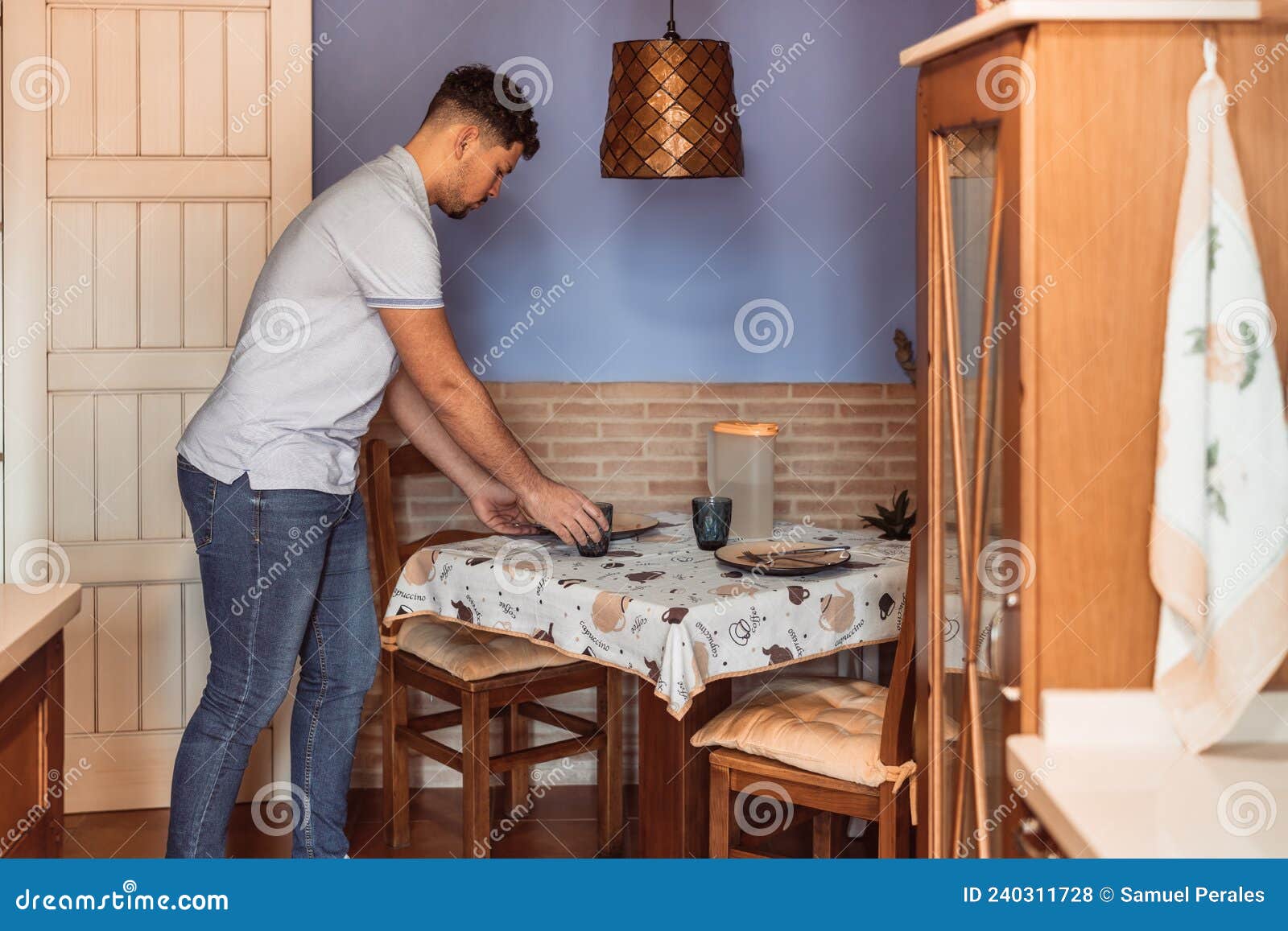 Young Man Clearing the Table after Lunch Stock Photo - Image of ...