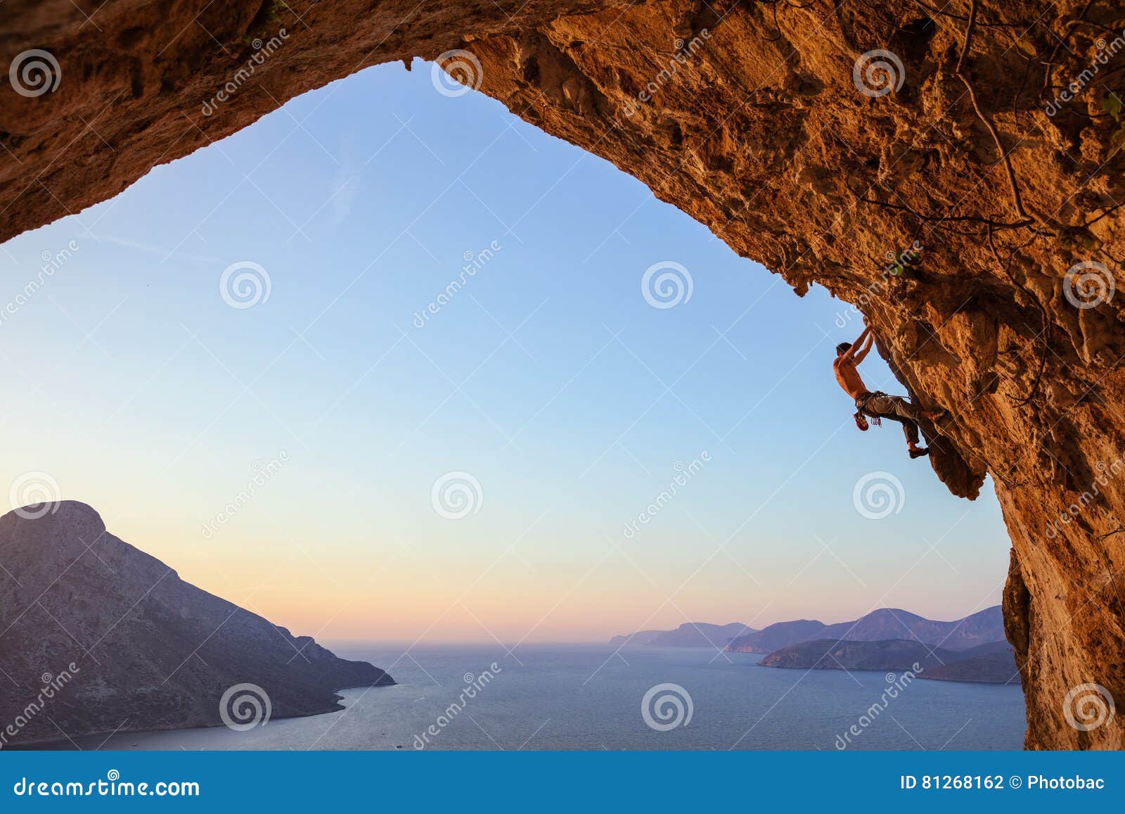 Young man climbing in cave stock photo. Image of nature - 81268162