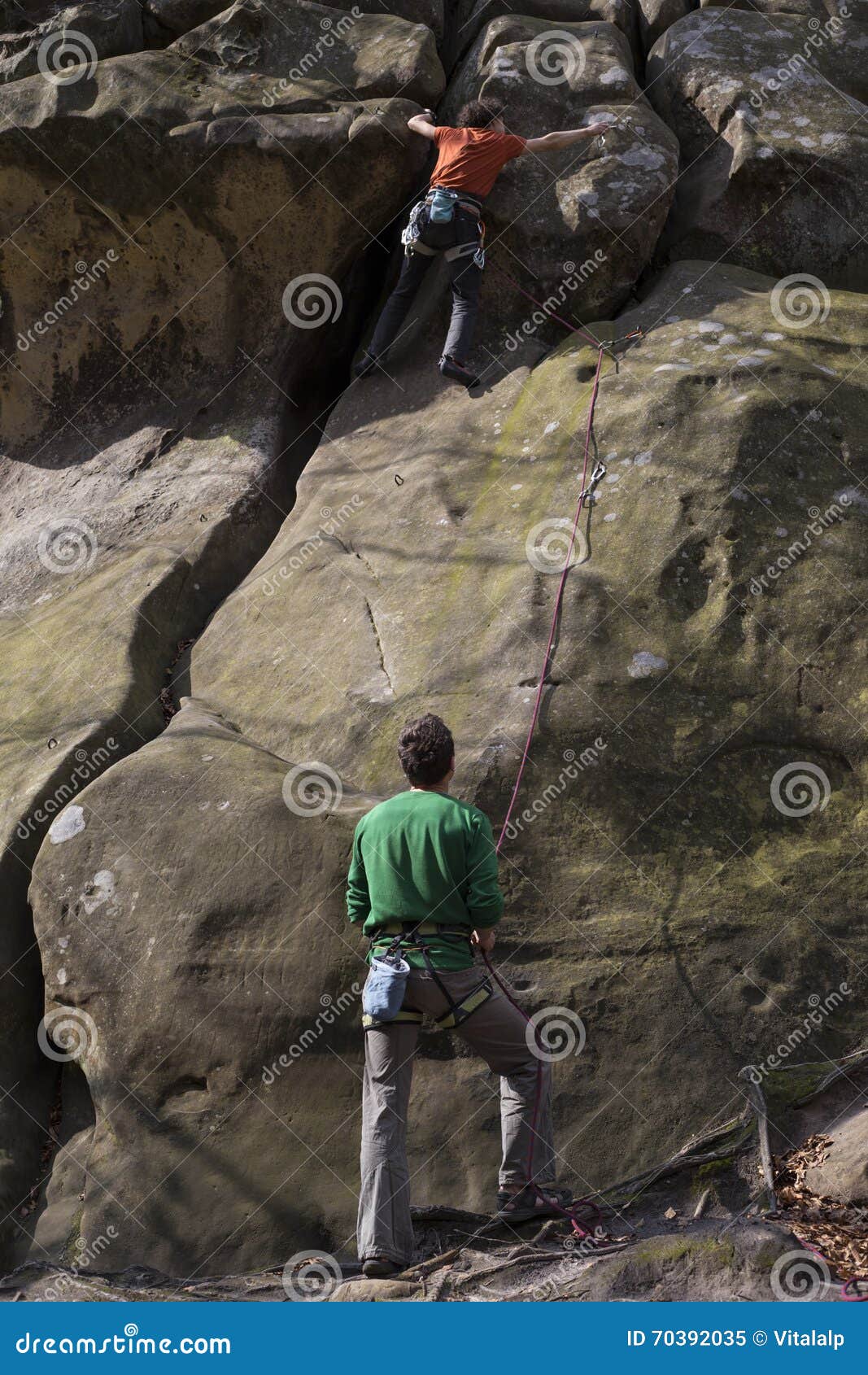 Young Man Climbs on a Cliff with a Rope. Stock Image - Image of extreme ...