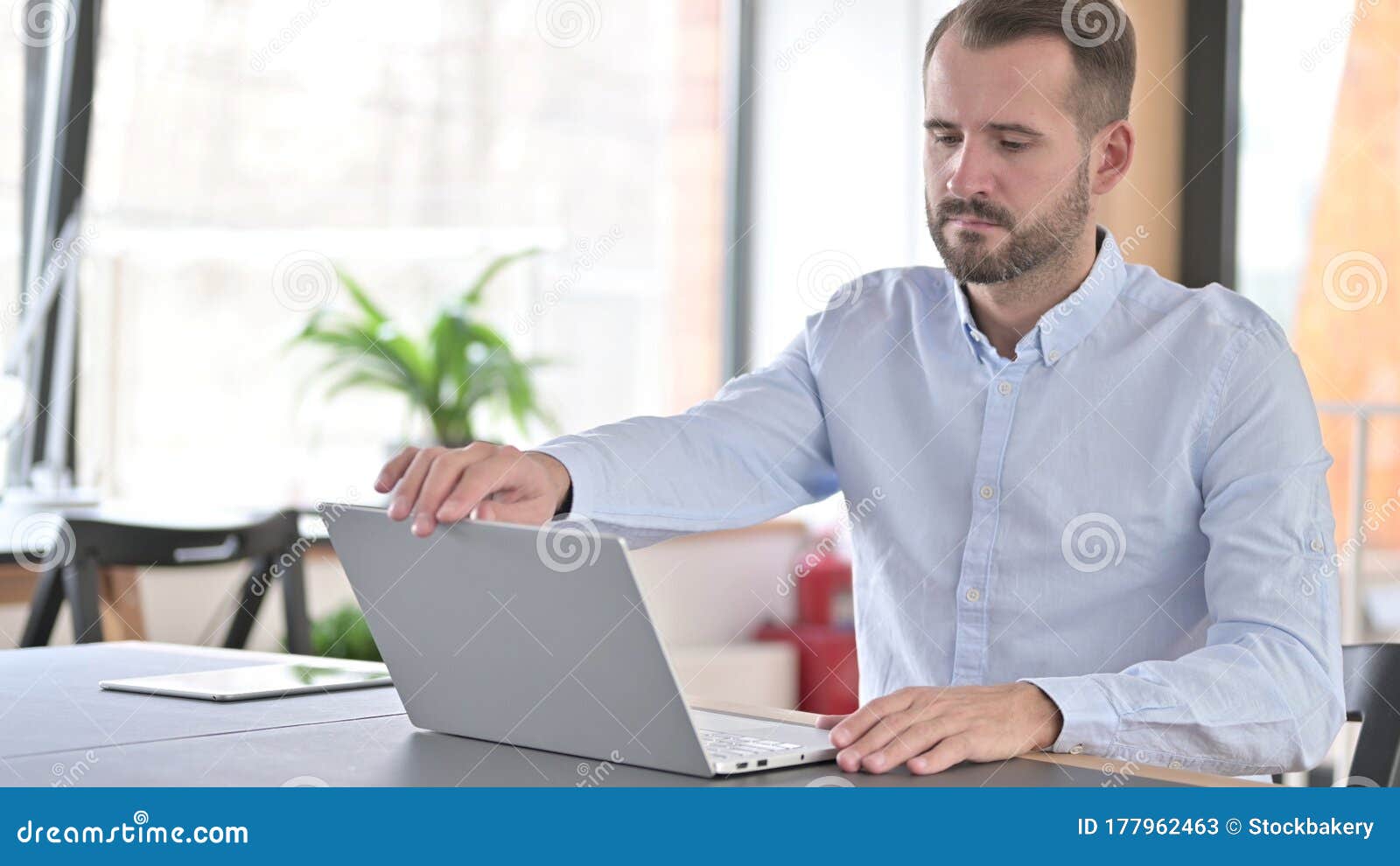 Young Man Closing Laptop after Work Stock Image - Image of sitting ...