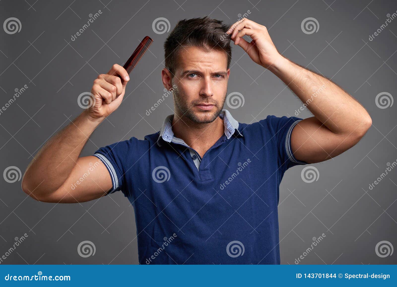 Young man with comb stock photo. Image of preparation - 143701844