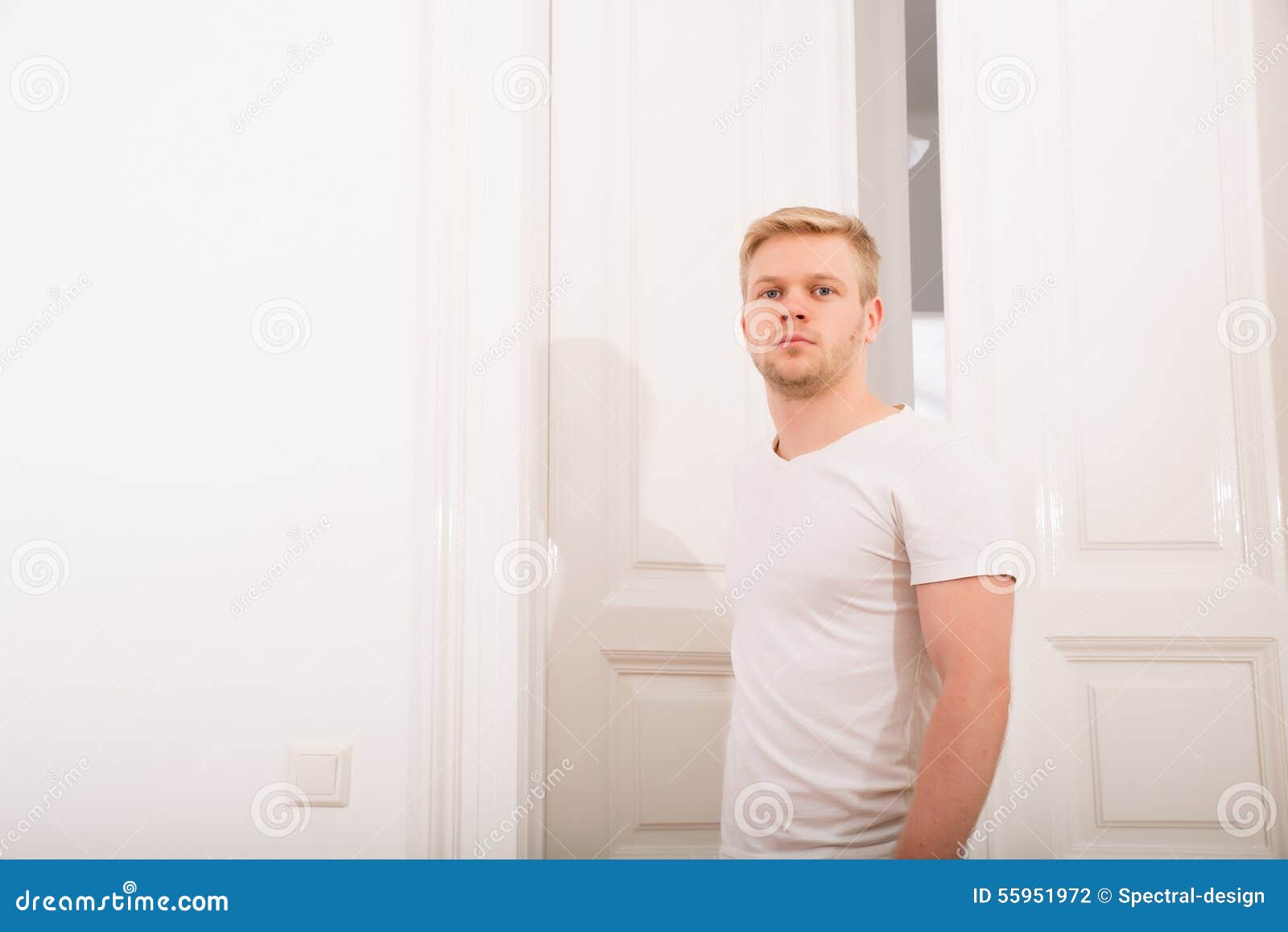 Young man coming home stock photo. Image of front, living - 55951972