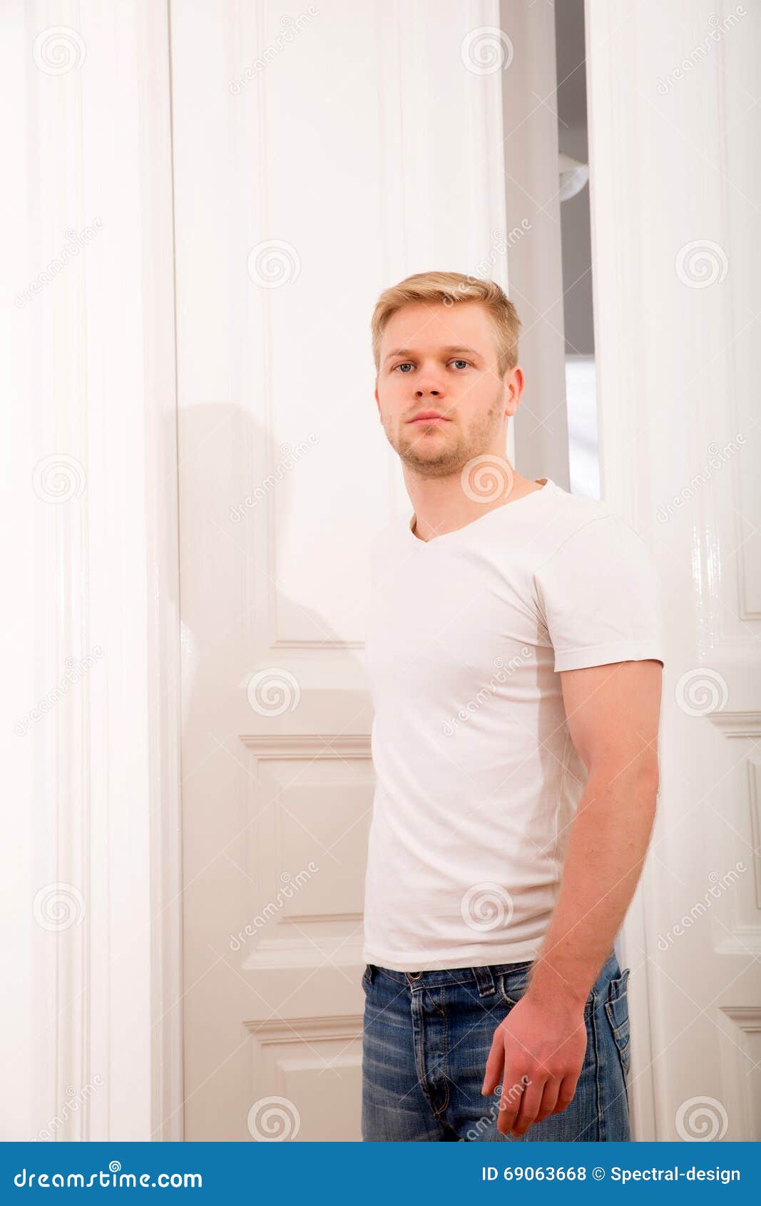 Young man coming home stock photo. Image of handsome - 69063668