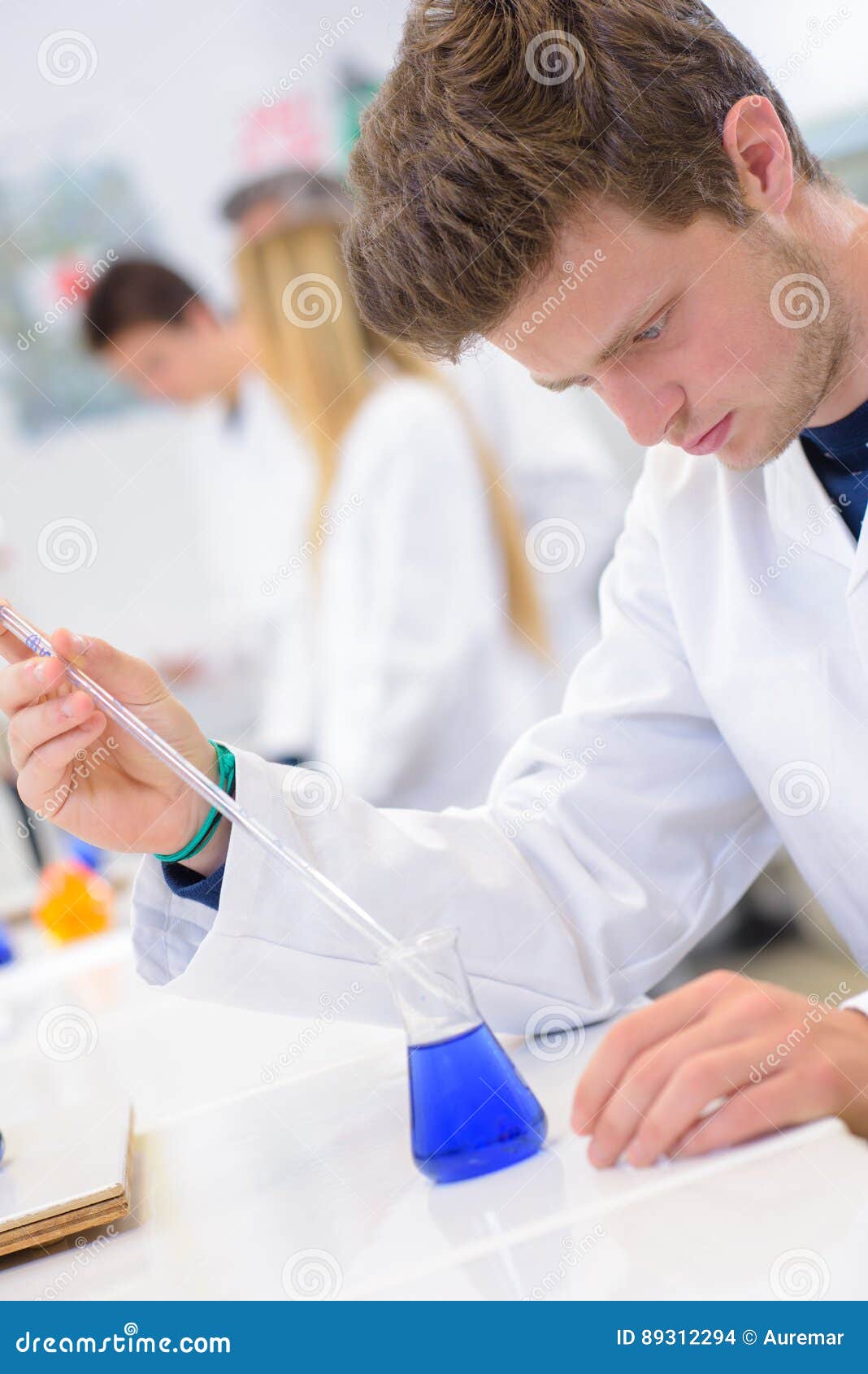 Young Man Conducting Scientific Experiment Stock Photo - Image of ...