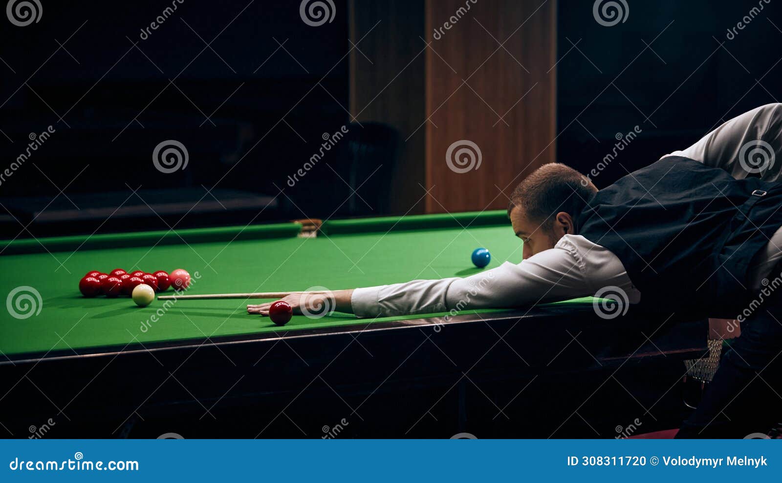 Young Man Confidently Studying Angles of Billiards Table, Playing ...