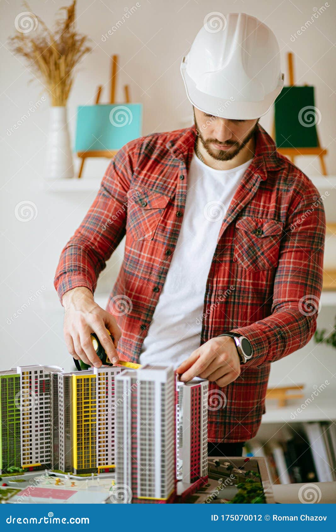 Young Man Constructs a New High-rise Building Stock Photo - Image of ...