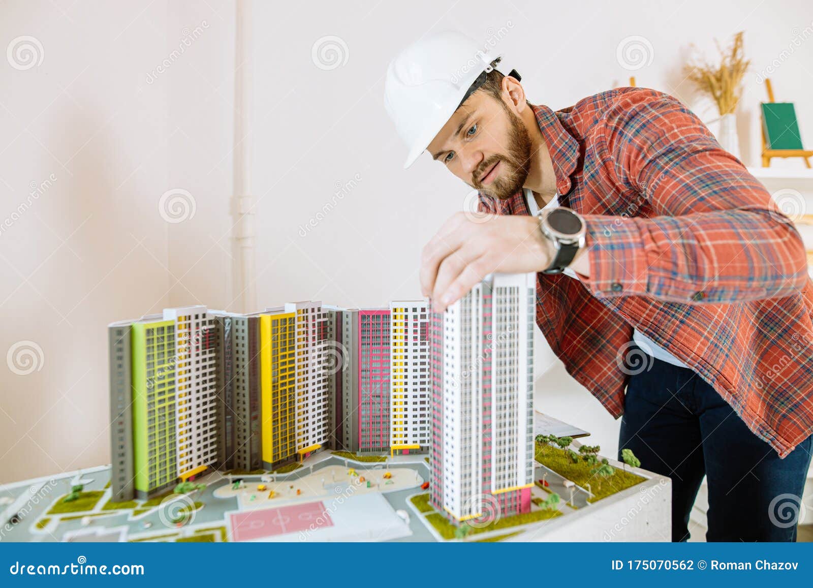 Young Man Constructs a New High-rise Building Stock Photo - Image of ...