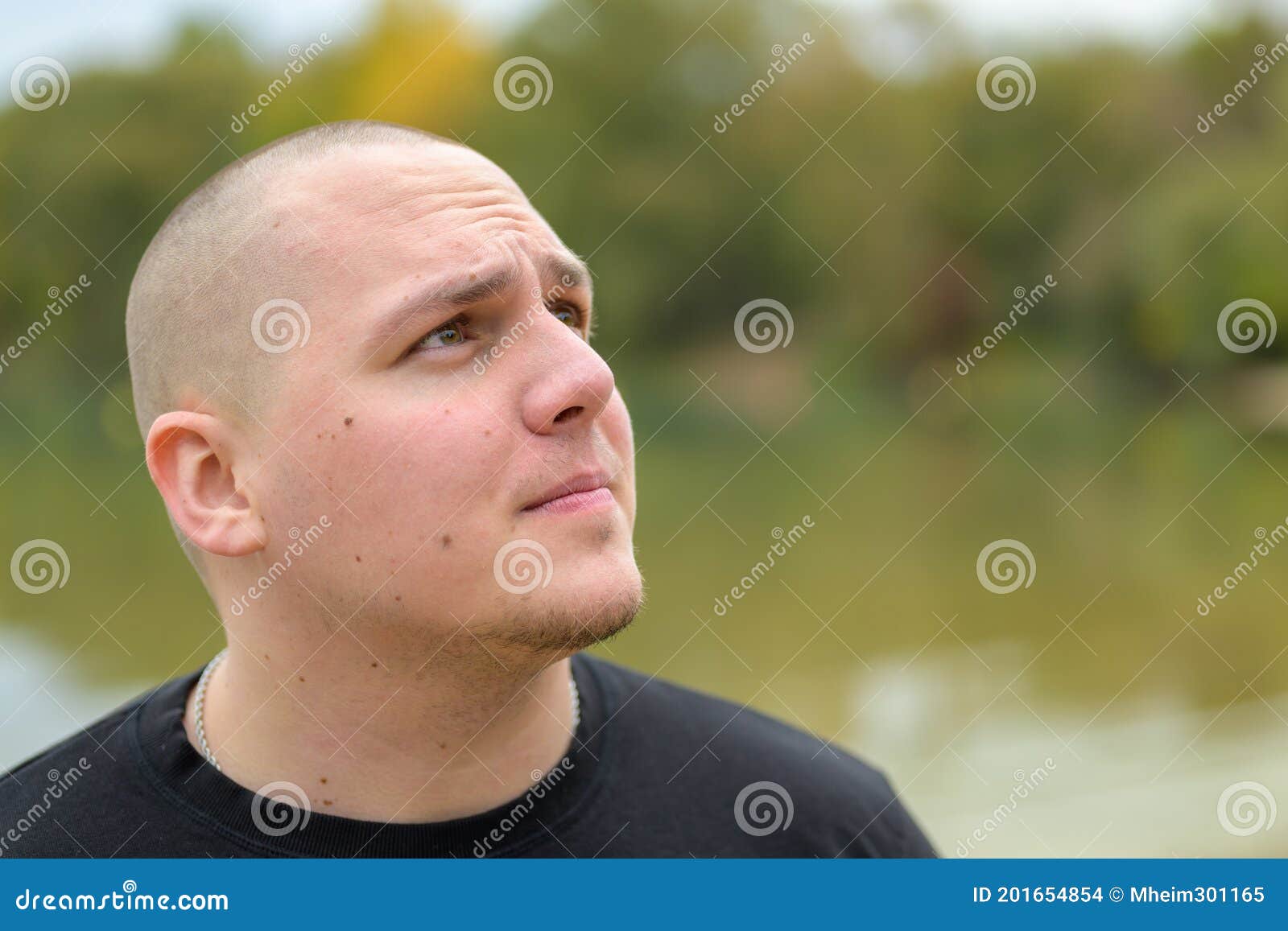 Young Man with a Contemplative Expression Stock Photo - Image of smile ...