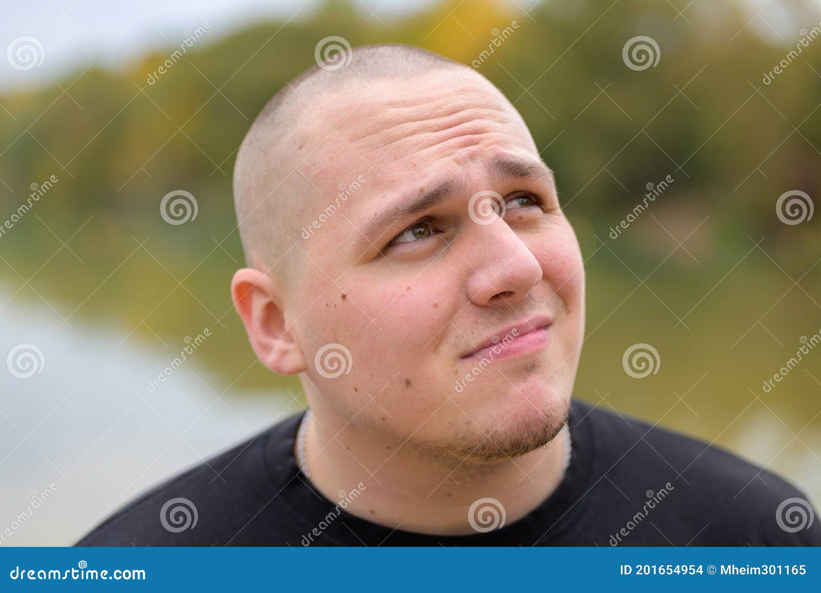 Young Man with a Contemplative Expression Stock Photo - Image of ...
