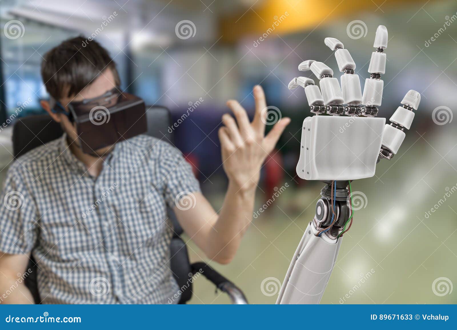 Young Man is Controlling Robotic Hand with Virtual Reality Headset ...