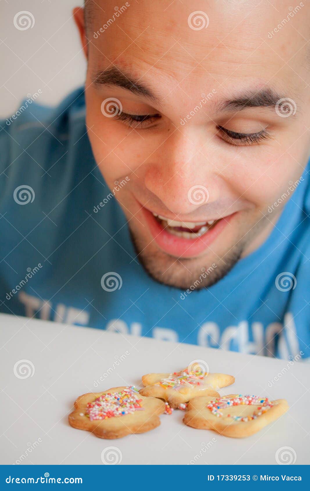Young man with cookies stock image. Image of chinees - 17339253