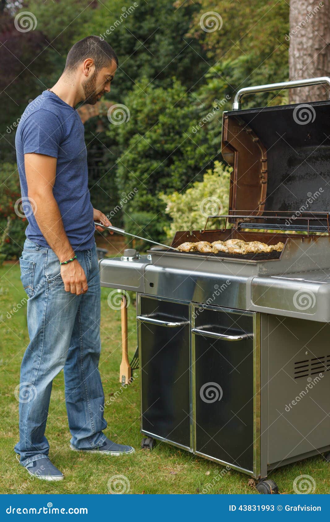 Young man cooking stock image. Image of outdoor, barbecue - 43831993