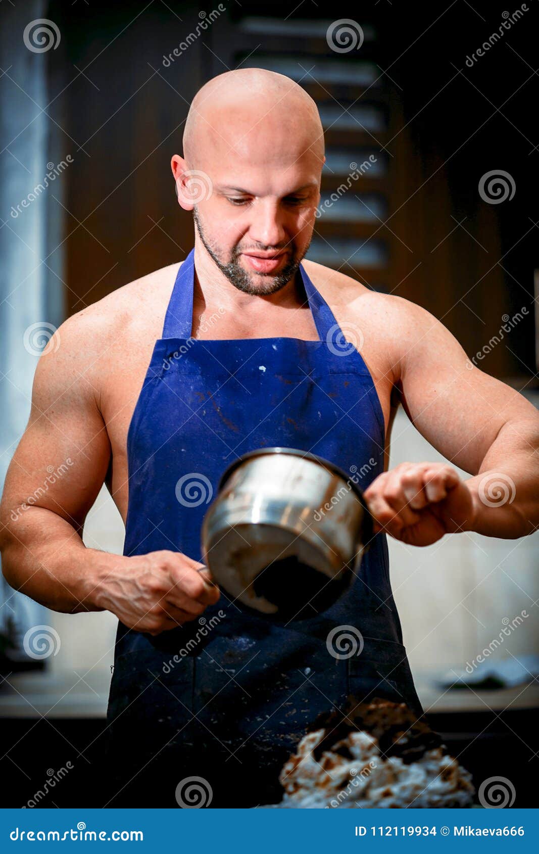 A Young Man is Cooking in a Large Kitchen Stock Photo - Image of eggs ...
