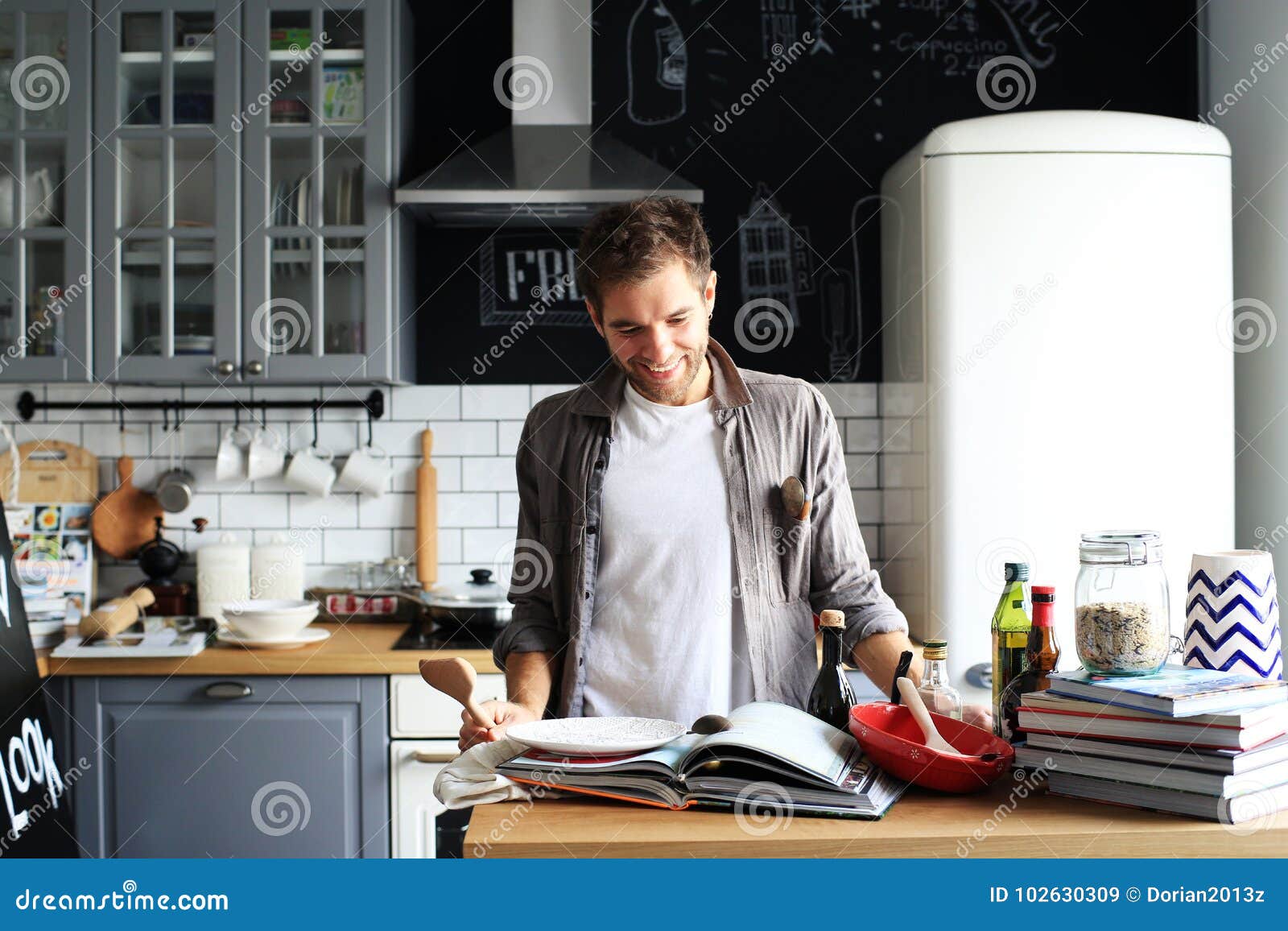 Young man cooking lunch stock image. Image of restaurant - 102630309