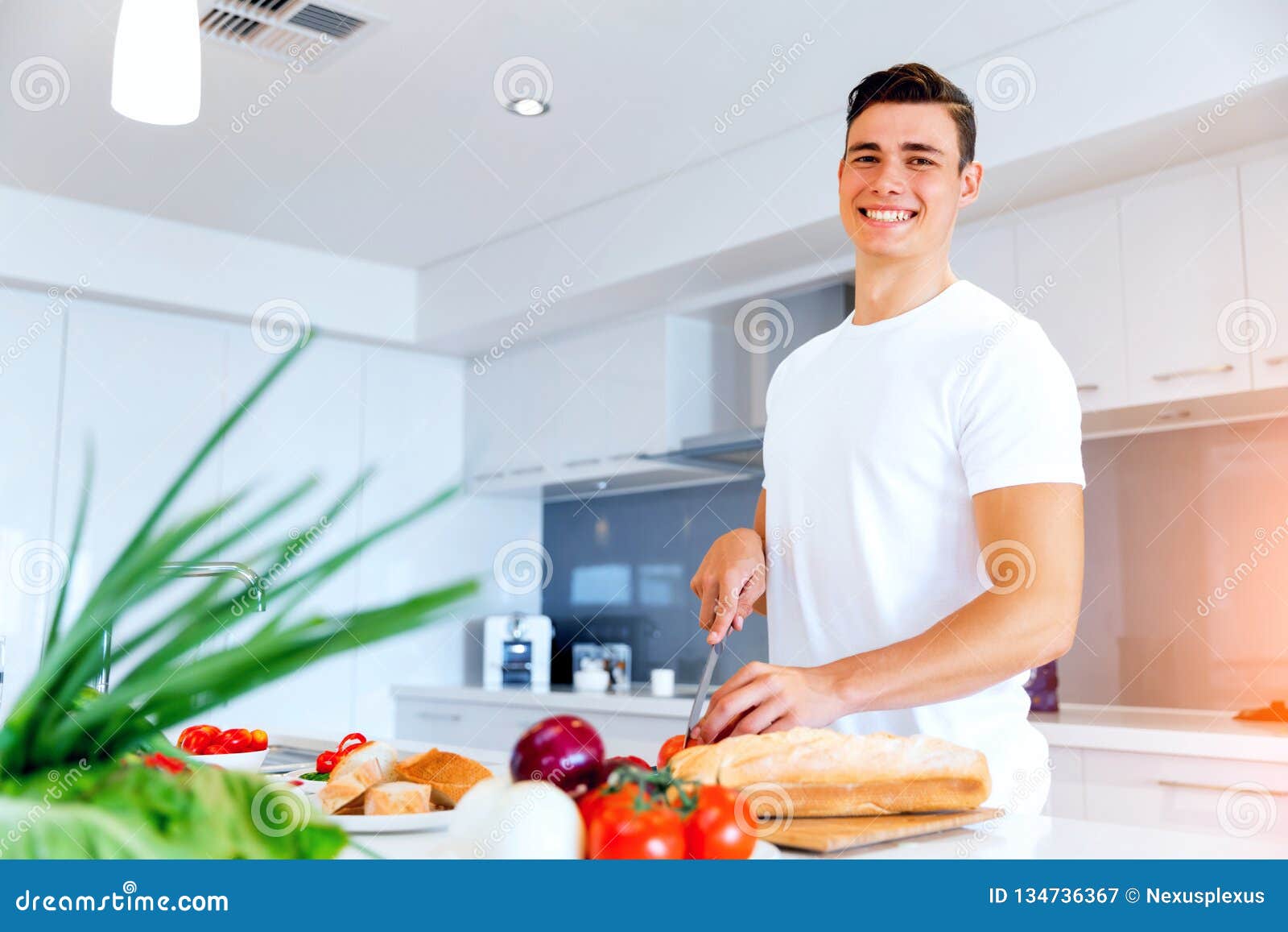 Young man cooking stock image. Image of caucasian, healthy - 134736367