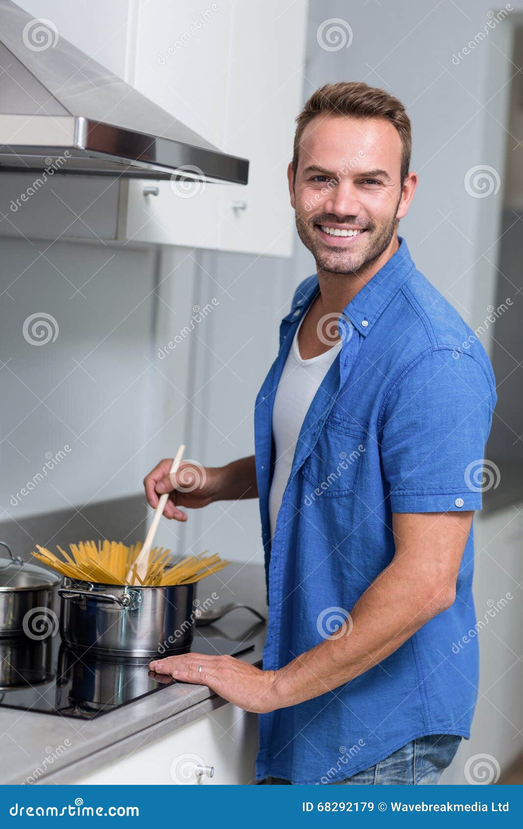 Young Man Cooking Spaghetti Stock Image - Image of life, casual: 68292179