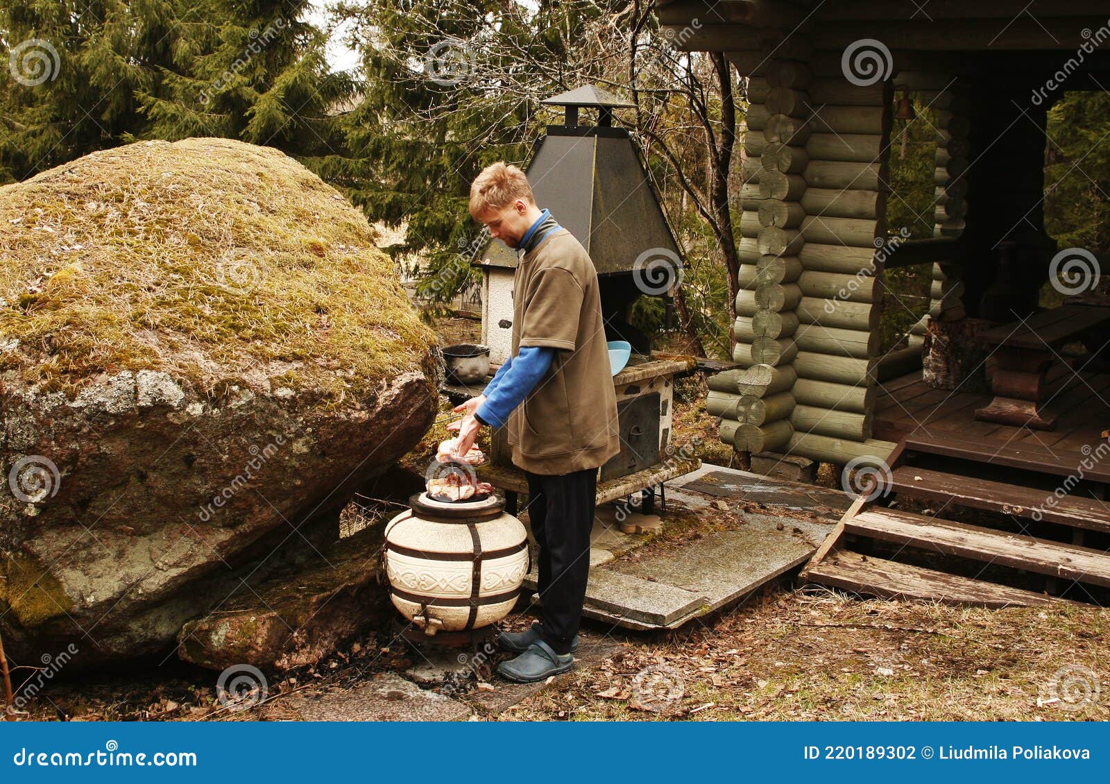 Young Man in a Country Dacha Prepares Meat on the Grill Stock Photo ...