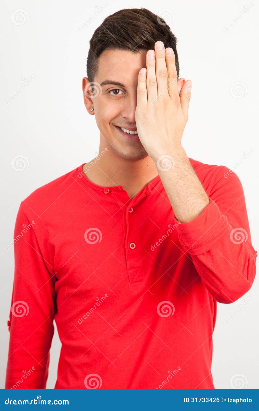 Young man covering one eye stock photo. Image of young - 31733426