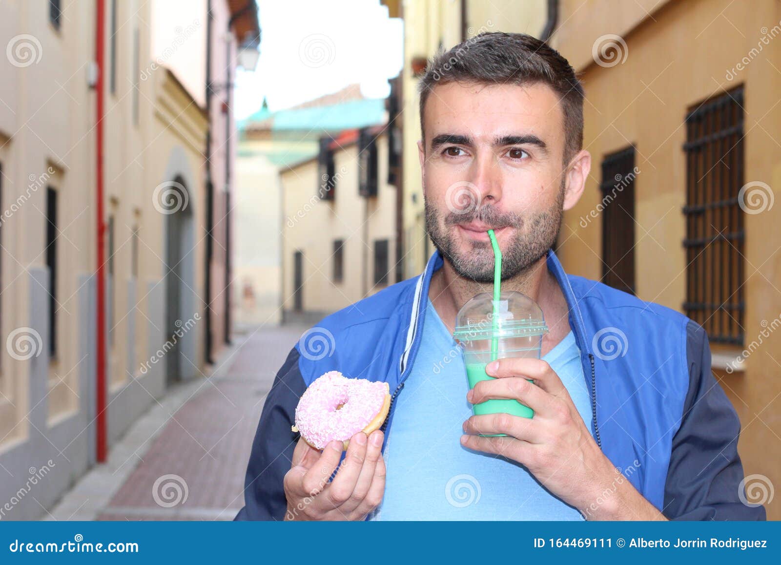 Young man craving a donut stock image. Image of high - 164469111