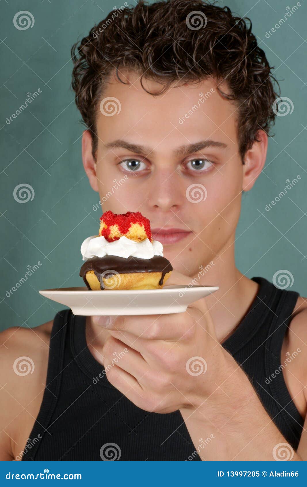 Young man with cupcake stock image. Image of handsome - 13997205