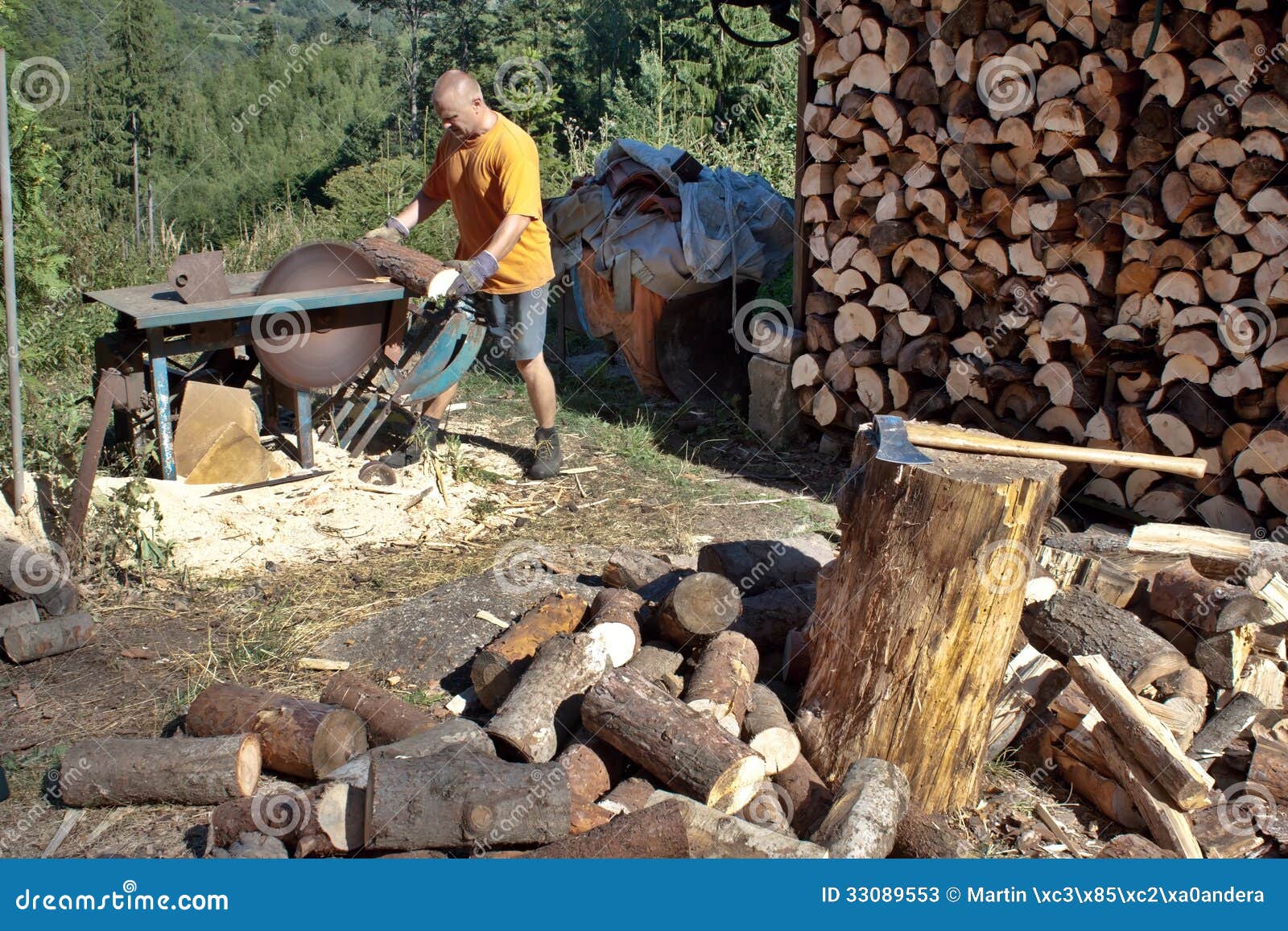 Young Man Cutting Firewood, Preparing for Winter Stock Image - Image of ...