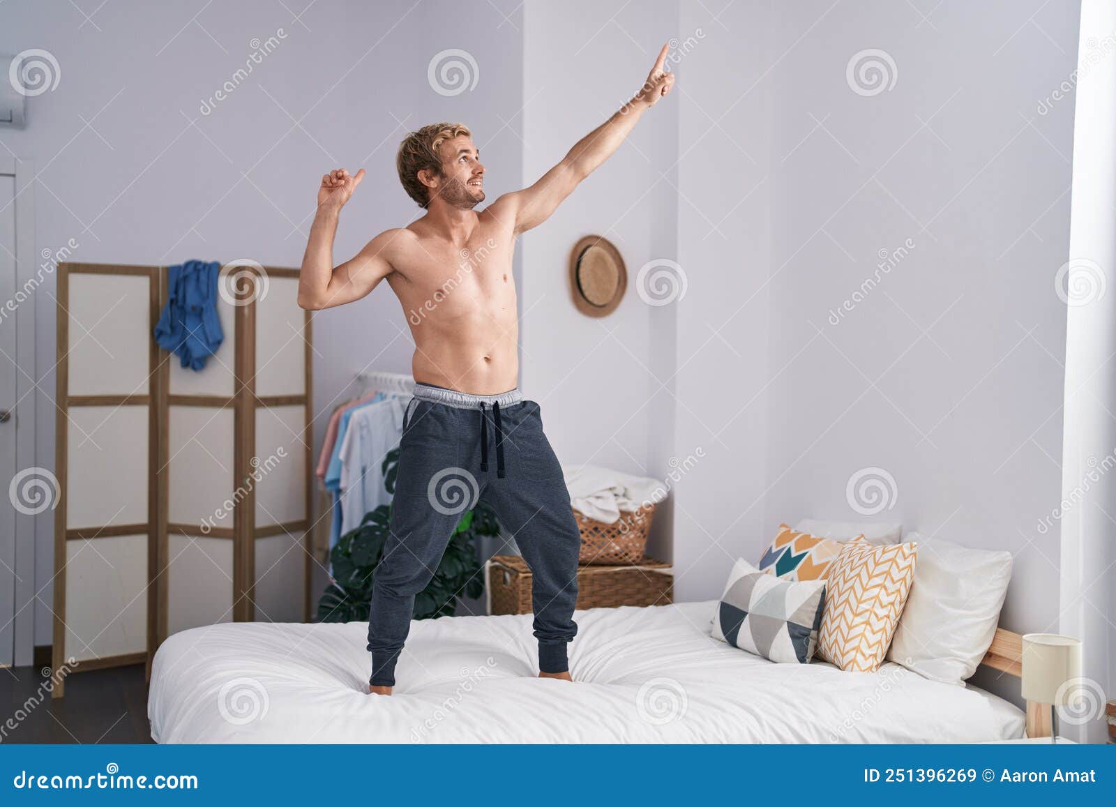 Young Man Dancing on Bed at Bedroom Stock Image - Image of pillow ...