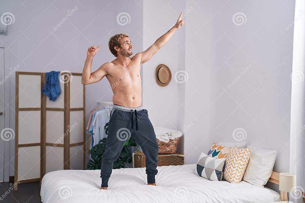 Young Man Dancing on Bed at Bedroom Stock Image - Image of pillow ...