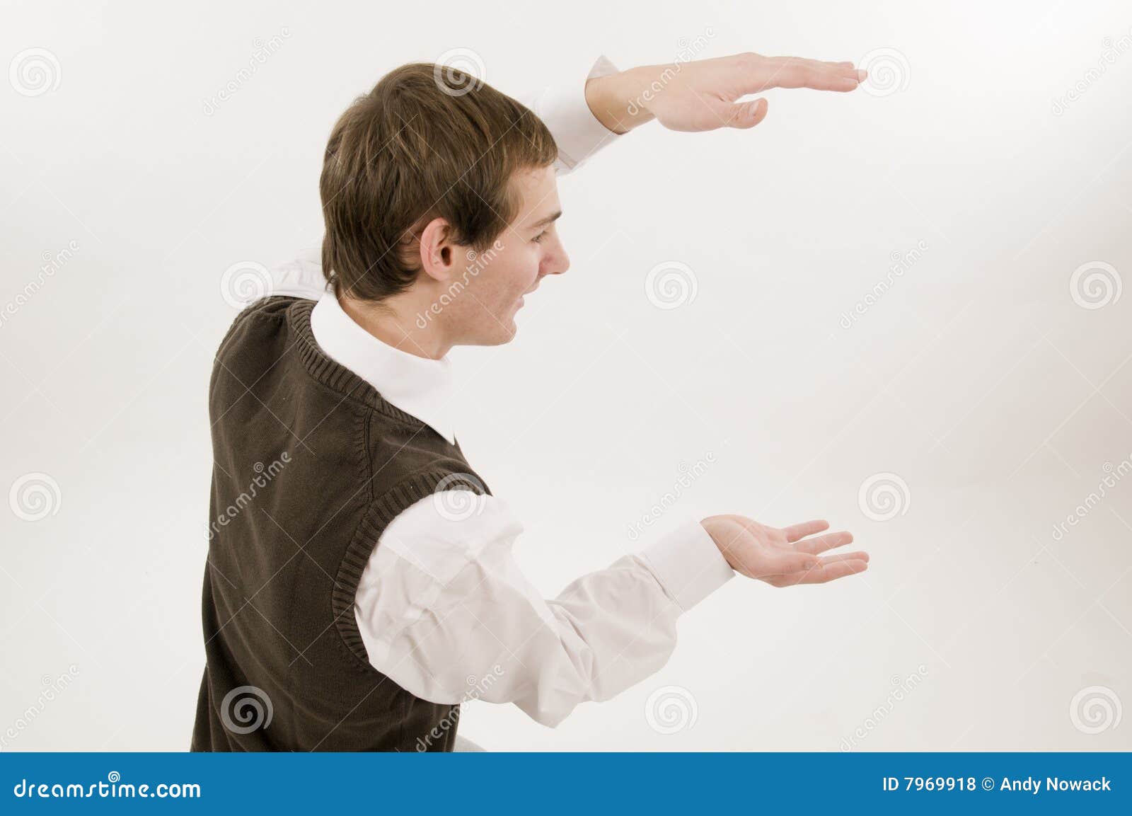 Young Man Demonstrating Dimensions Stock Photo - Image of jumper ...