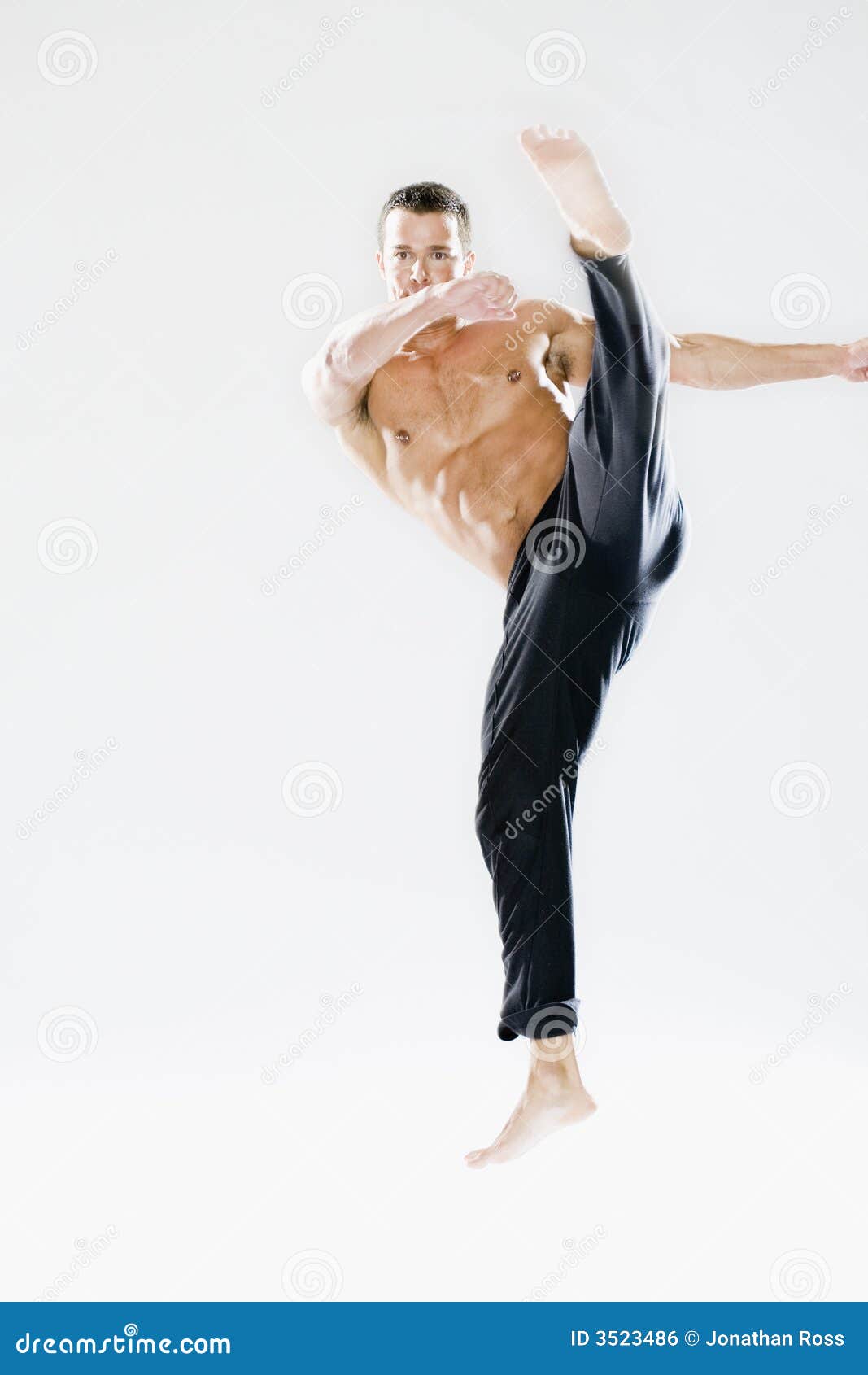 Young Man Demonstrating Kick Stock Photo - Image of arts, people: 3523486