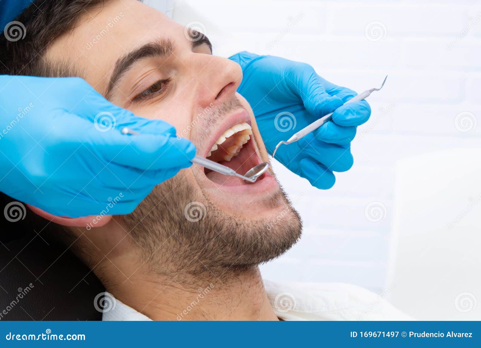 Young man at the dentist stock image. Image of insurance - 169671497