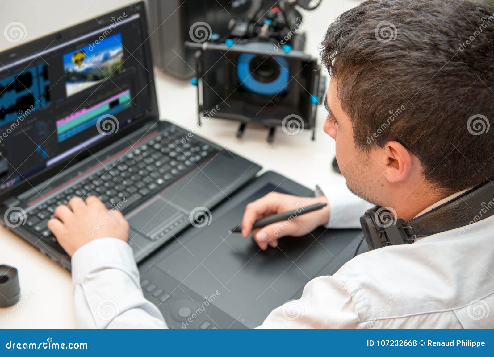 Young Man Designer Using Graphics Tablet for Video Editing Stock Photo ...