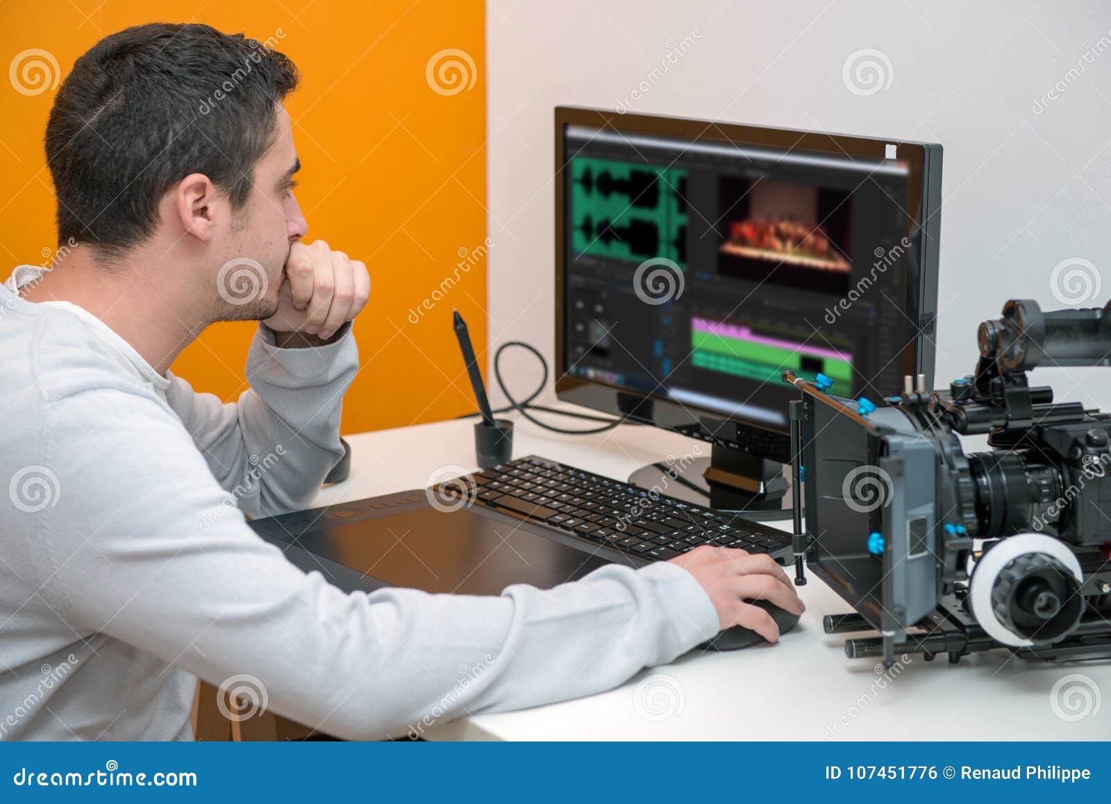 Young Man Designer Using Graphics Tablet for Video Editing Stock Photo ...