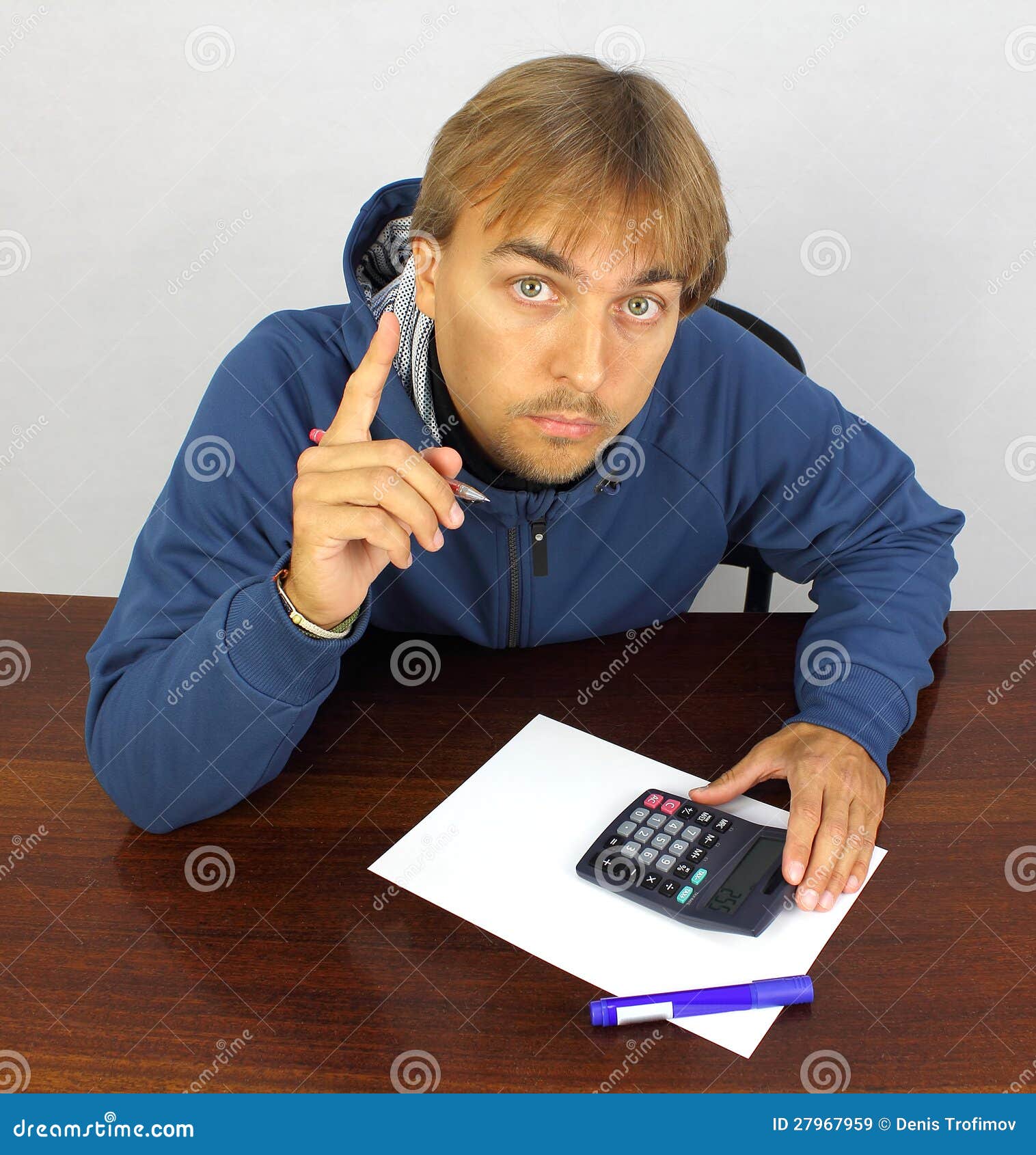 Young Man at the Desk with Calculator Stock Image - Image of paper ...