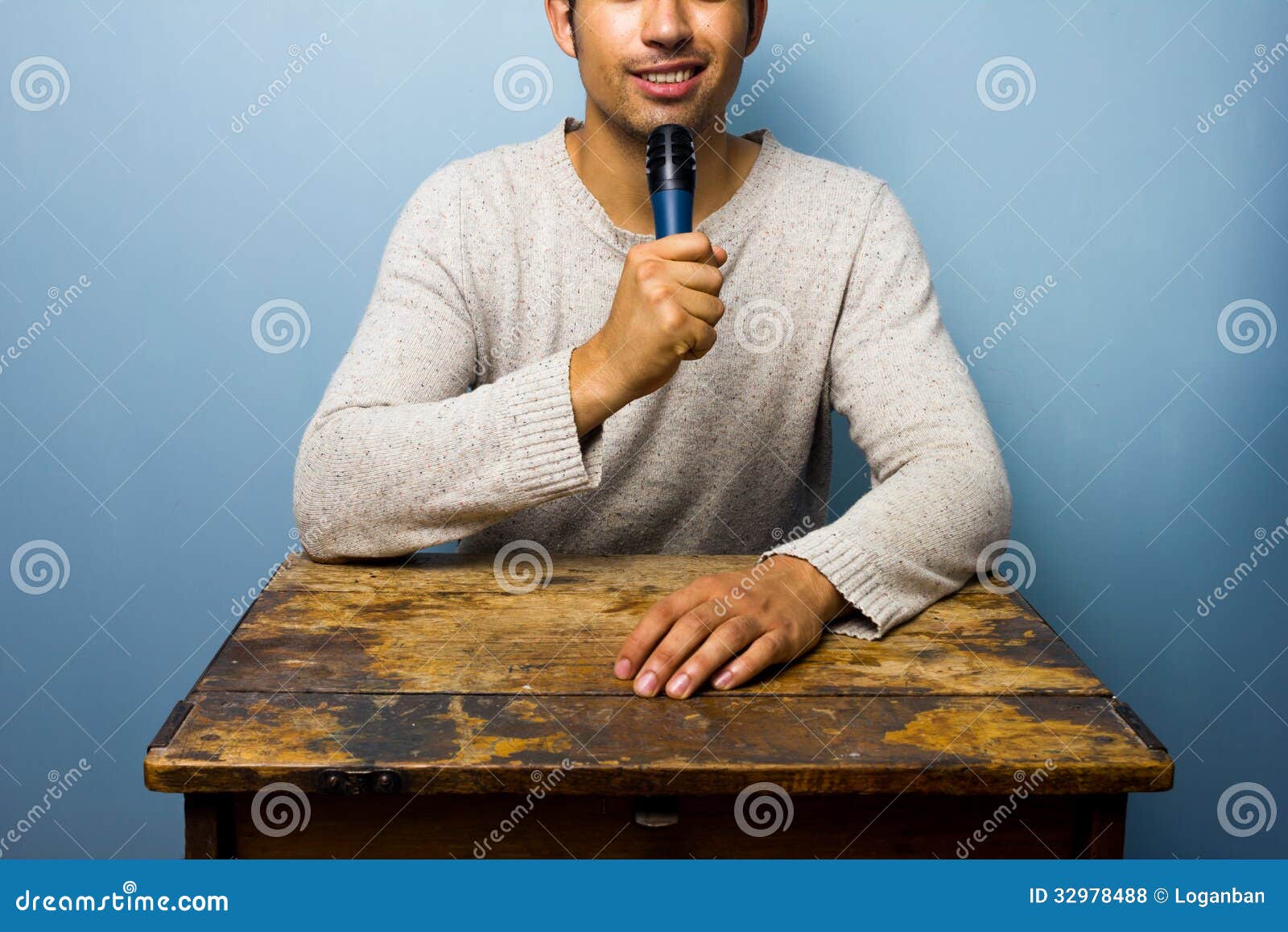 Young Man at Desk is Speaking into Microphone Stock Photo - Image of ...